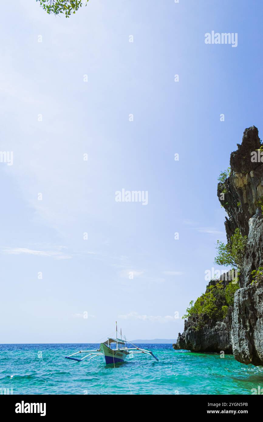 Tropical island rocks on a blue sea. Portrait. Calatrava, Romblon ...