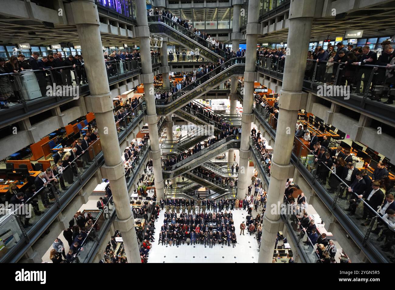 Staff line the atrium during the Lloyd's of London Armistice ...