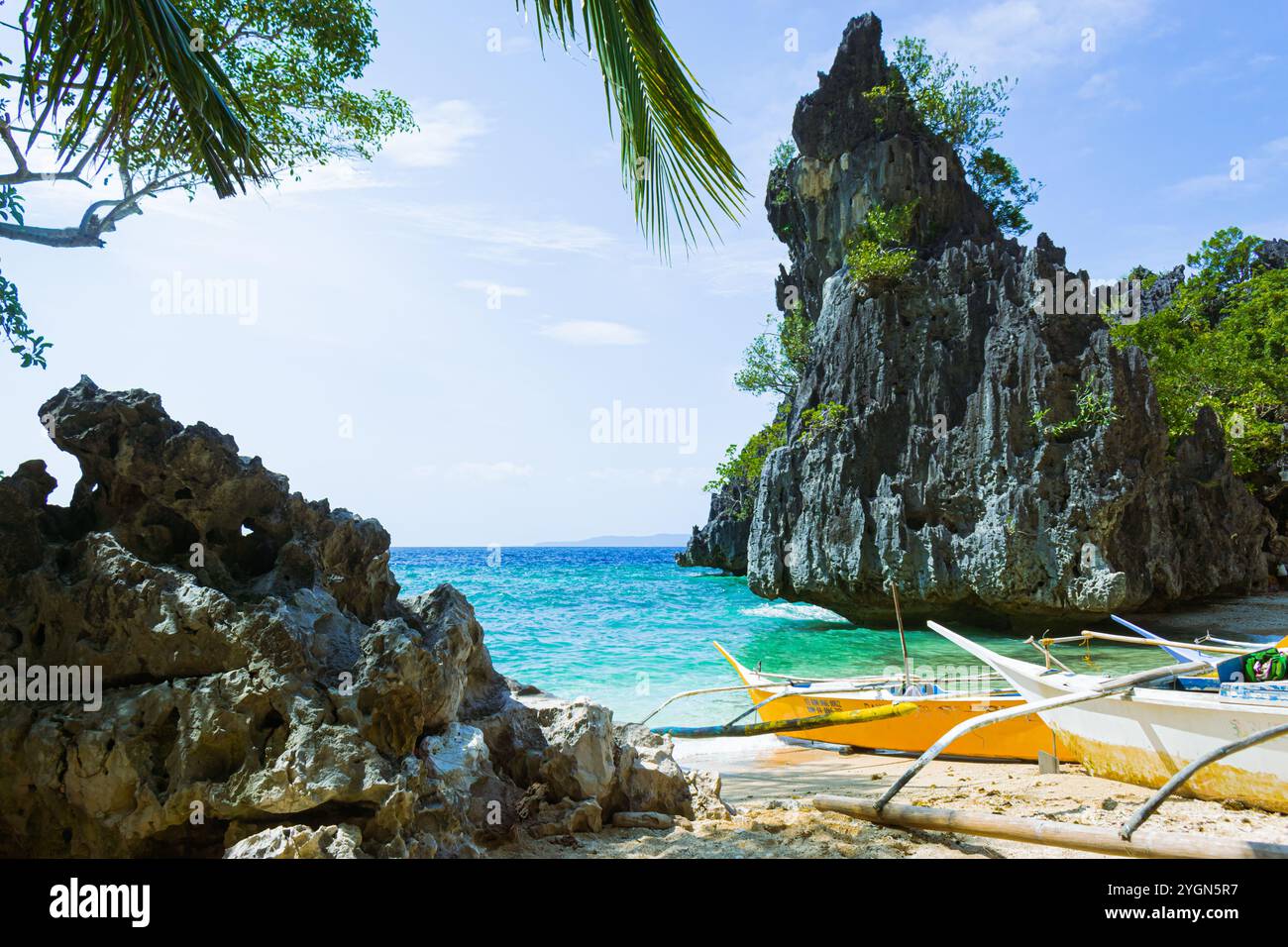 Tropical island rocks on a blue sea. Calatrava, Romblon, Philippines ...
