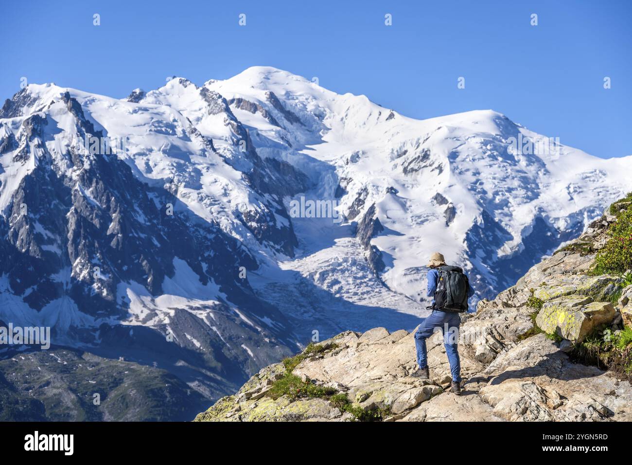 Mountaineer on a hiking trail in front of a mountain landscape, view of ...