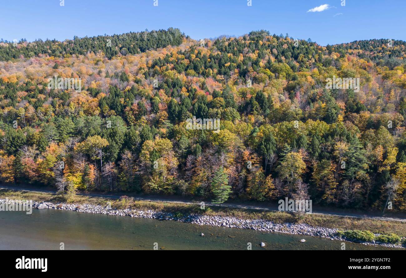 aerial view of autumn colours around the white river in the small town ...
