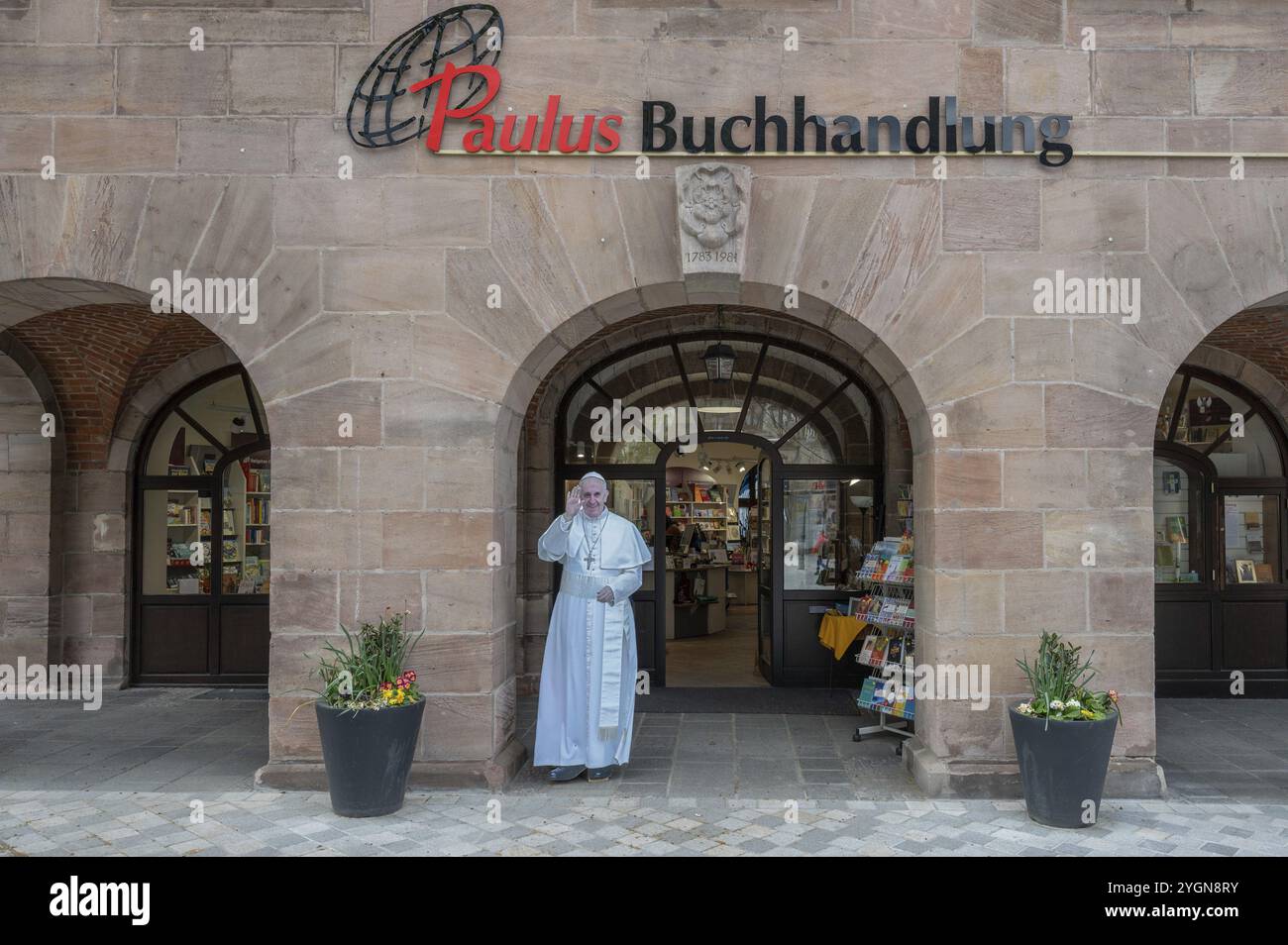Life-size statue of Pope Francis in front of the Paulus bookshop ...