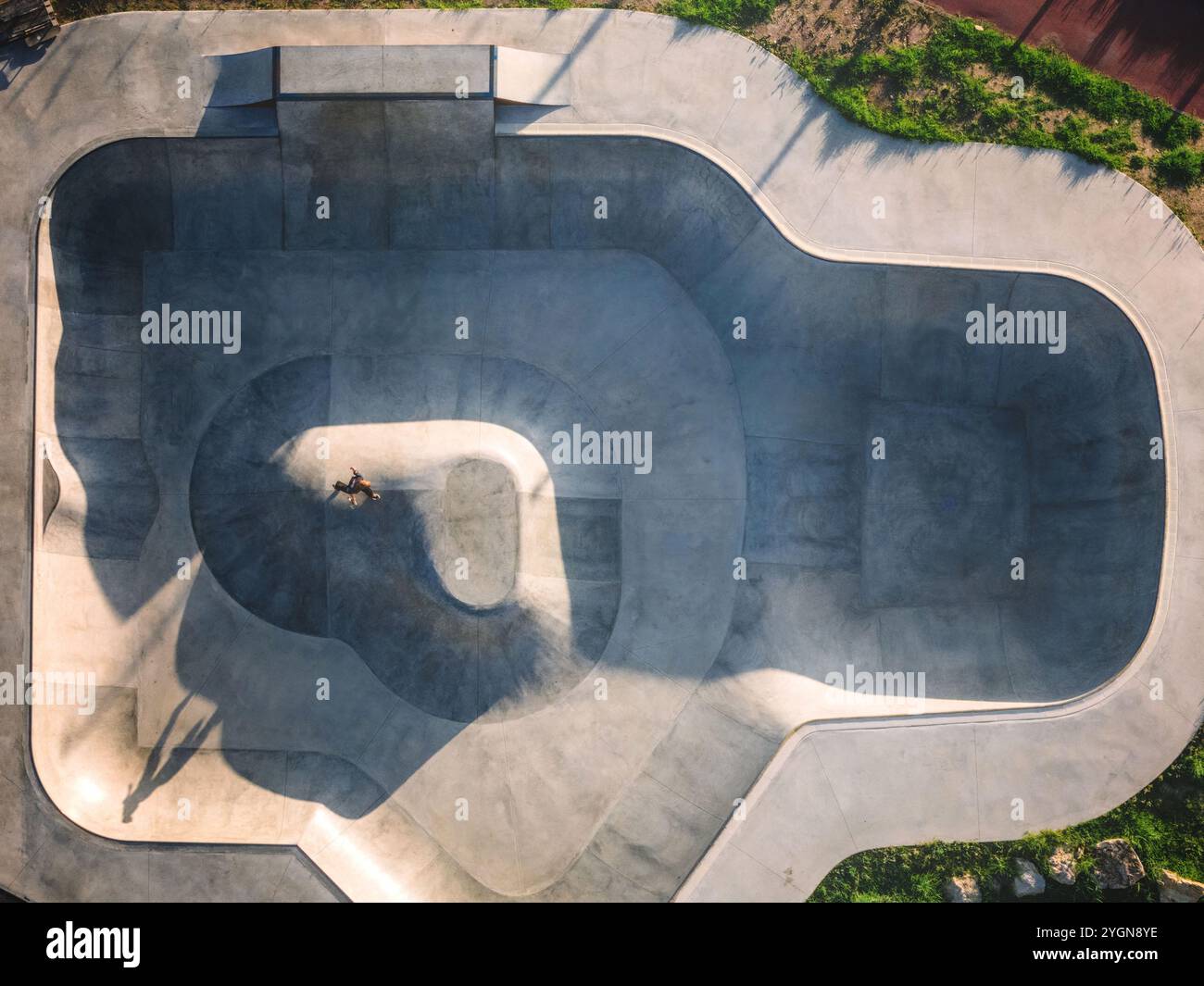 Aerial view of a modern skateboard park featuring diverse ramps and a ...