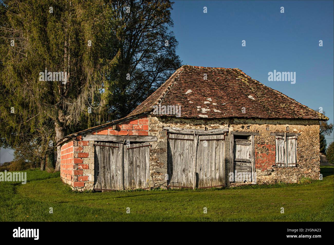 Haute-Vienne, France - November 7th 2024 - Ancient barn and garage aged ...