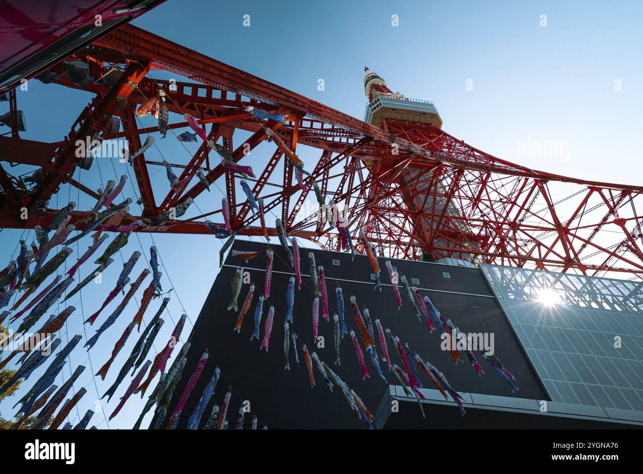 Foot of the Tokyo Tower with a view upwards. Dozens of carp flags are ...