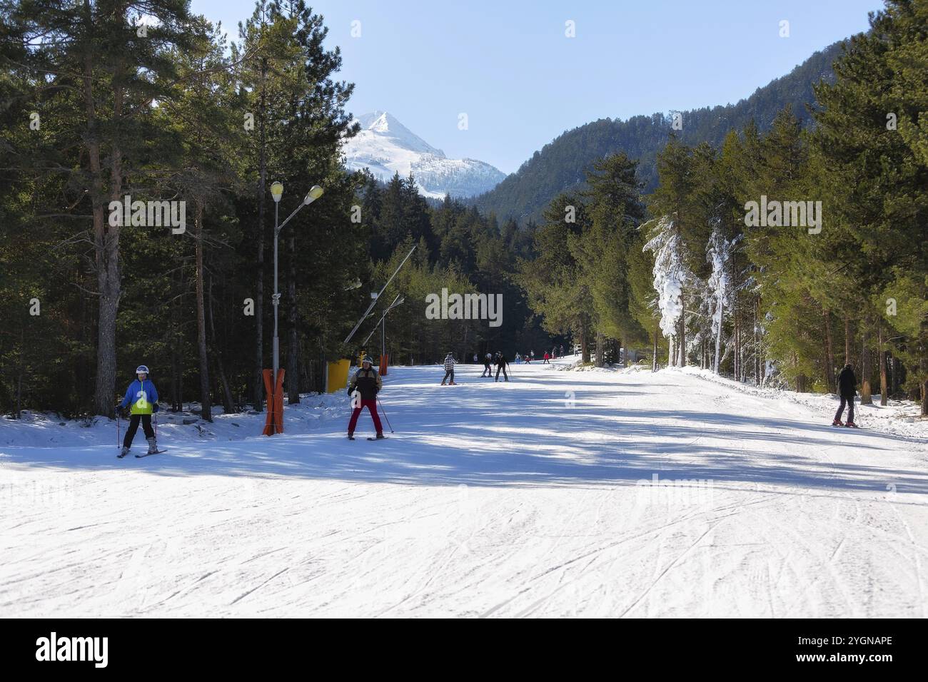 Bansko, Bulgaria, February 11, 2023: Winter landscape with ski road and ...