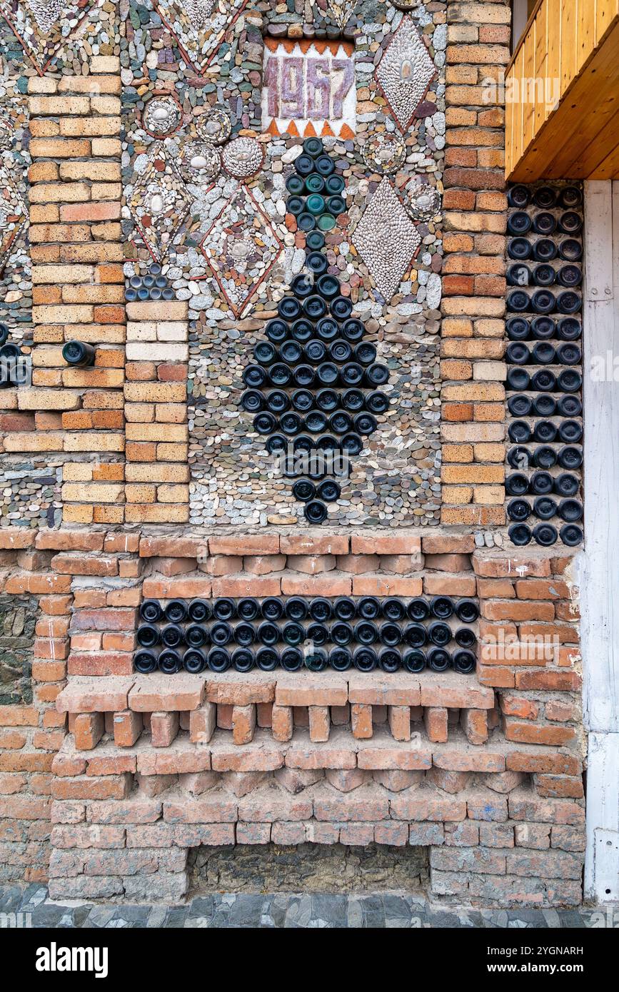 The Bottle House in Ganja, Azerbaijan showcases a decorative design of triangular patterns ...