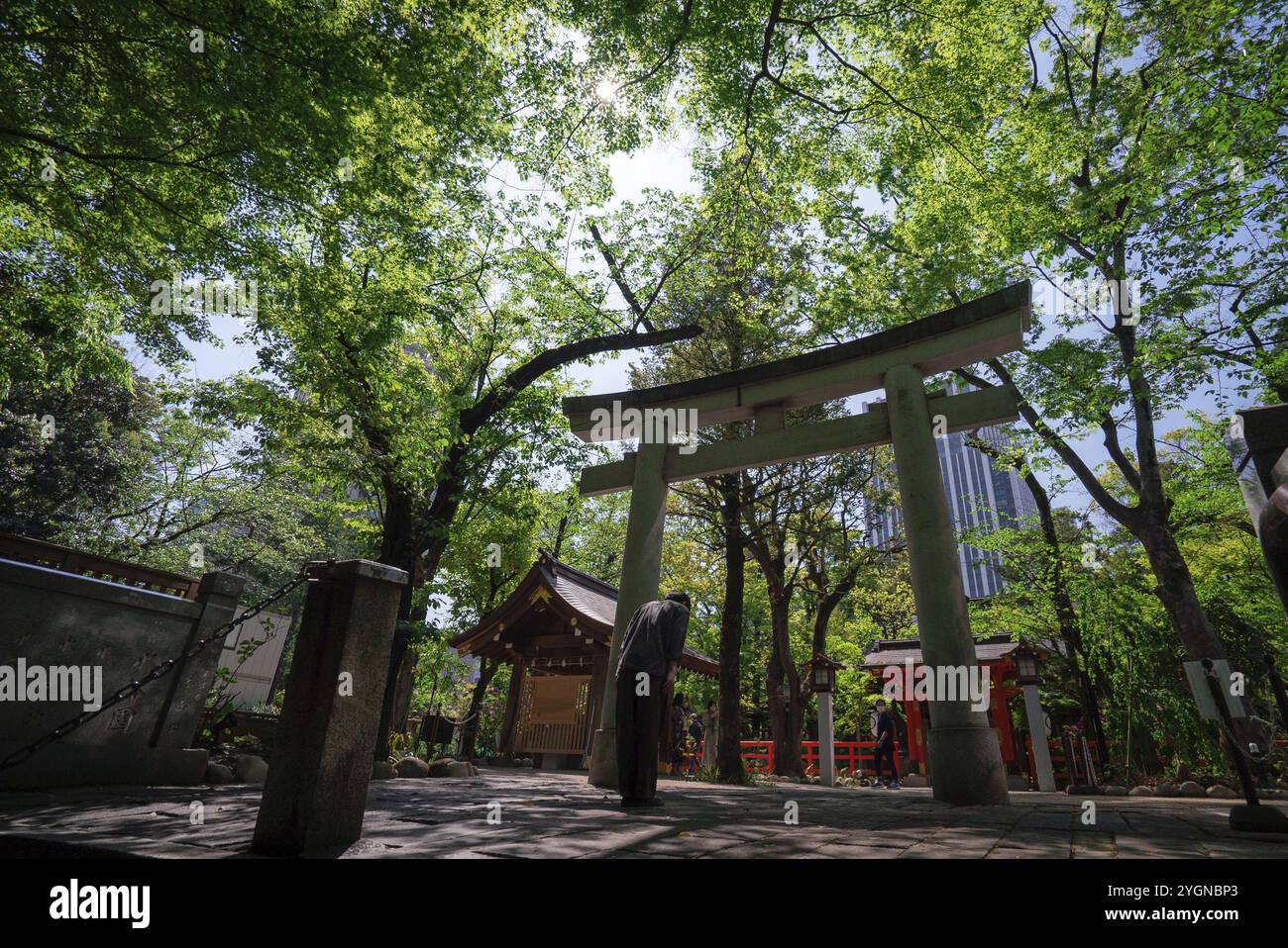 A man bows in front of entering the Atago Shinto shrine in Tokyo Stock ...