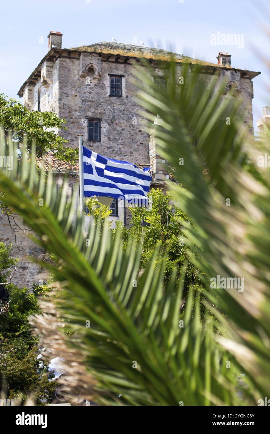 Ancient Ouranoupolis Tower on Athos peninsula in Halkidiki, flag of ...