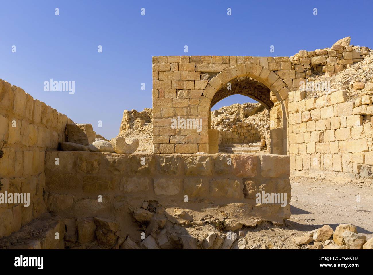 Arch and ruins of crusaders Shobak Castle in Jordan against blue sky ...