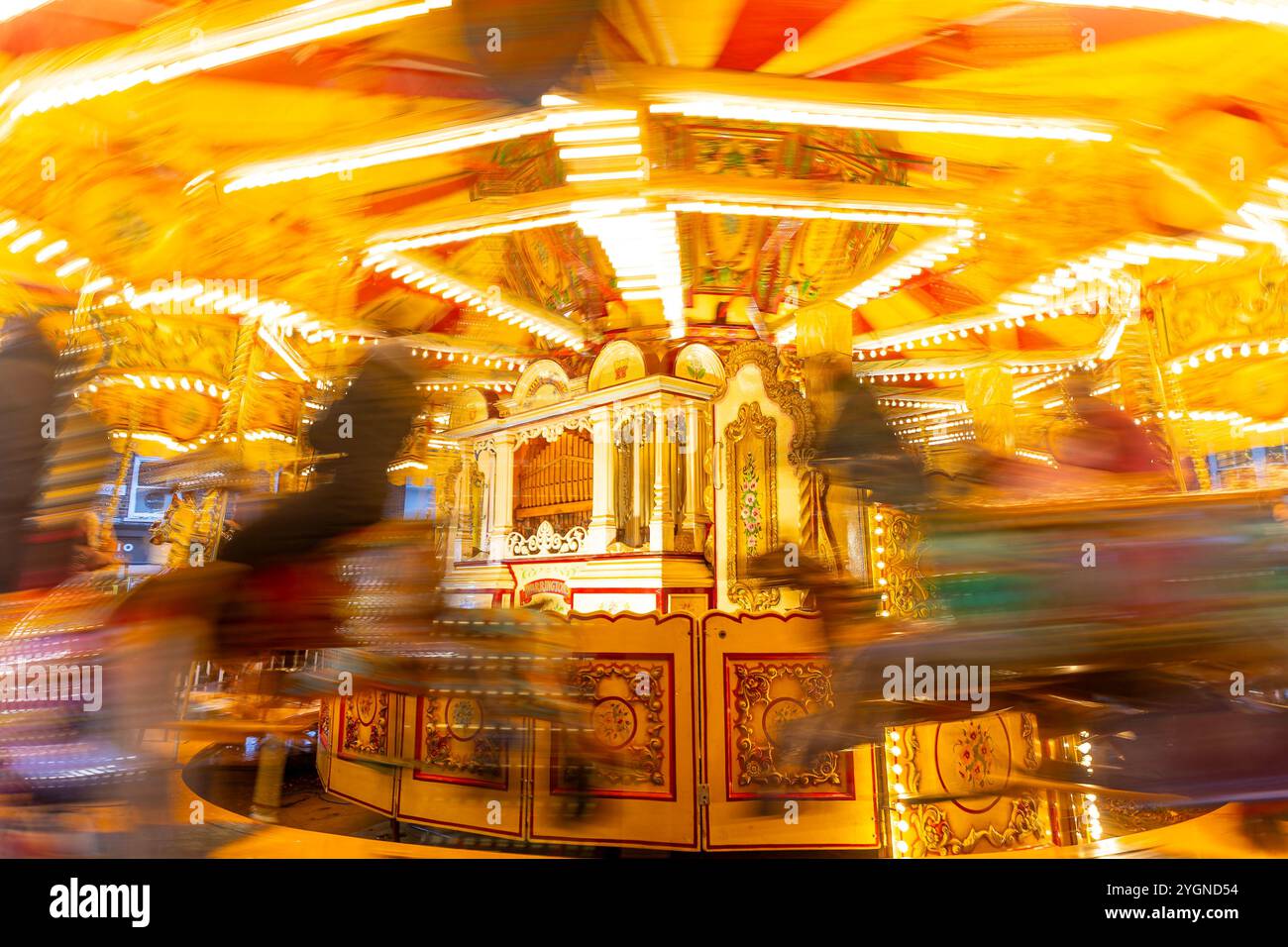 The golden blur of a carousel ride at York Christmas Market Stock Photo ...