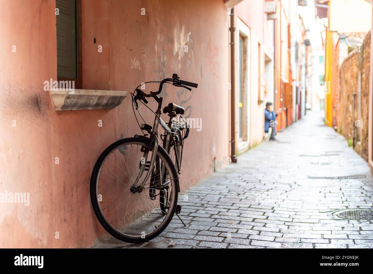passage way of italian ancient city with bicycle Stock Photo - Alamy