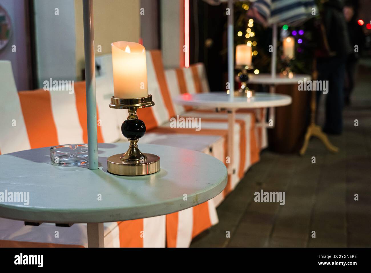 Tables of an outdoor restaurant. The candle is on the table. Minsk ...