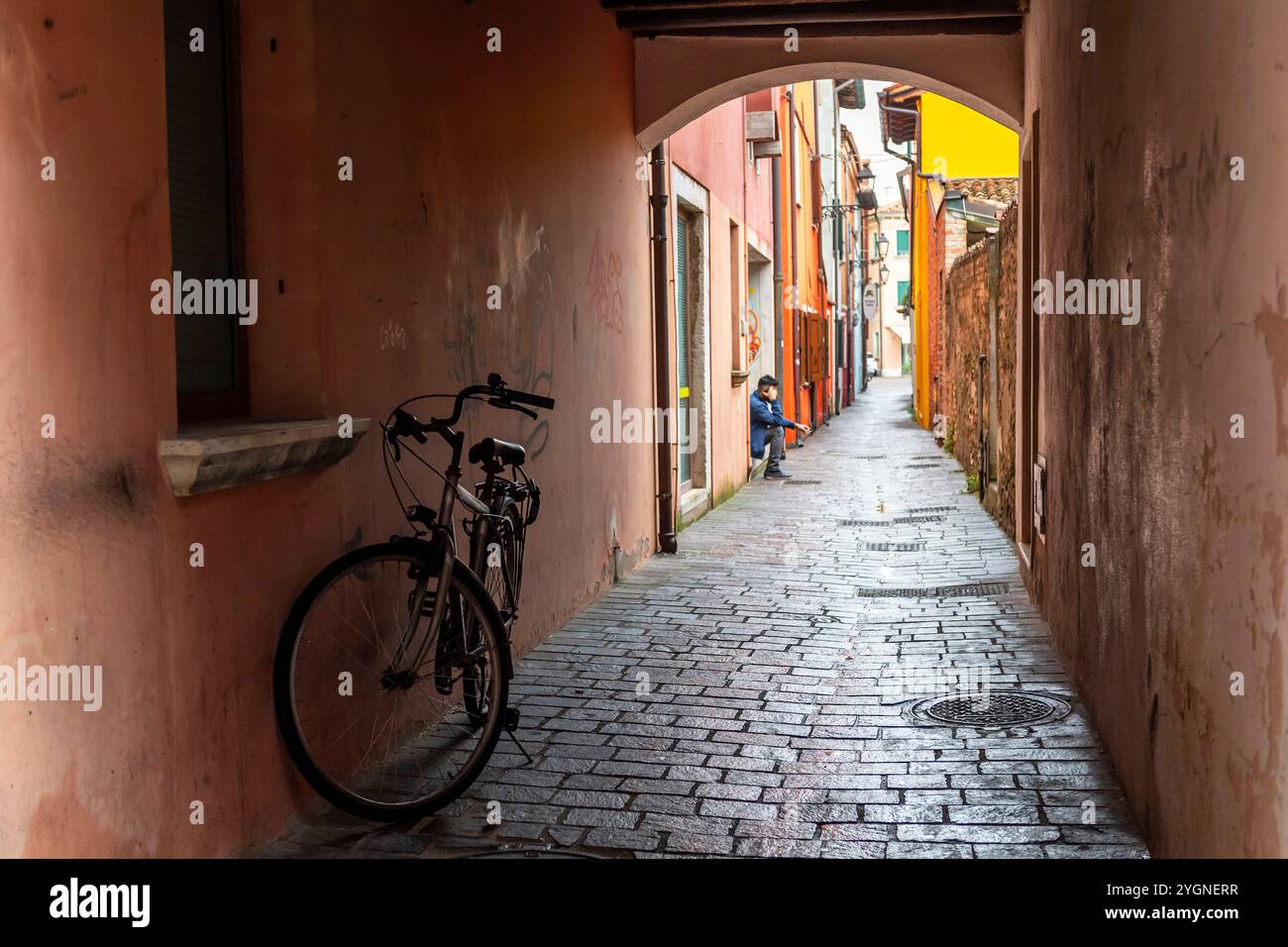 passage way of italian ancient city with bicycle Stock Photo - Alamy
