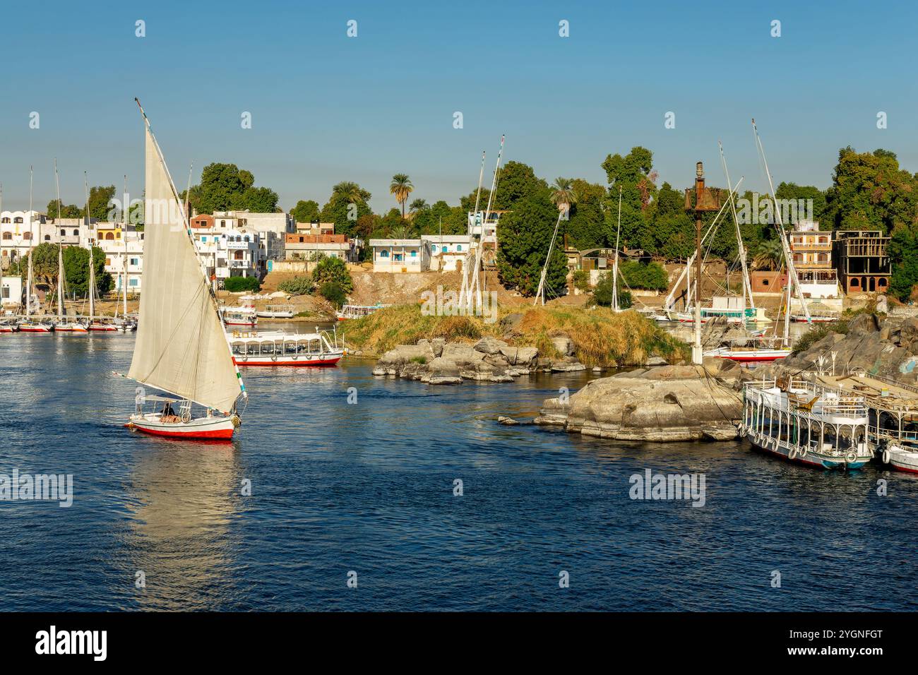 Felucca (traditional egyptian sailing boat) on the Nile river in Aswan ...
