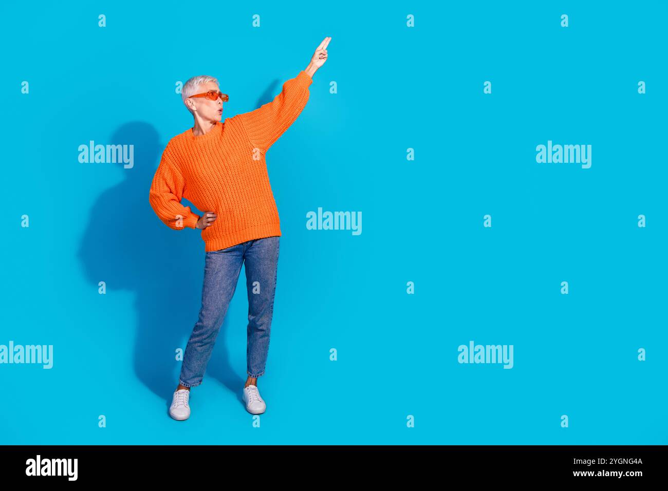 Photo of cool old lady dancing point finger empty space demonstrate ads ...