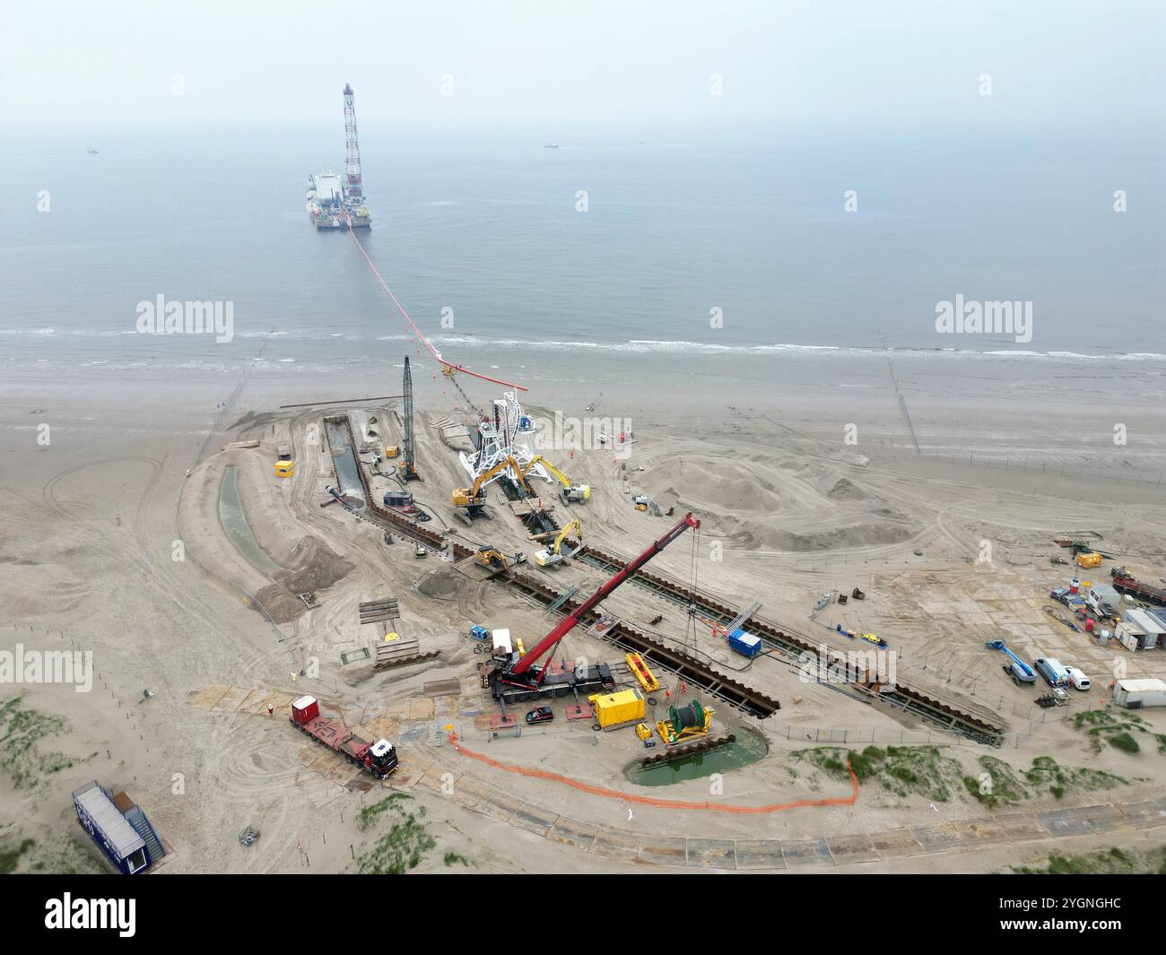 Connecting a seacable from an offshore windpark to an onshore power hub ...