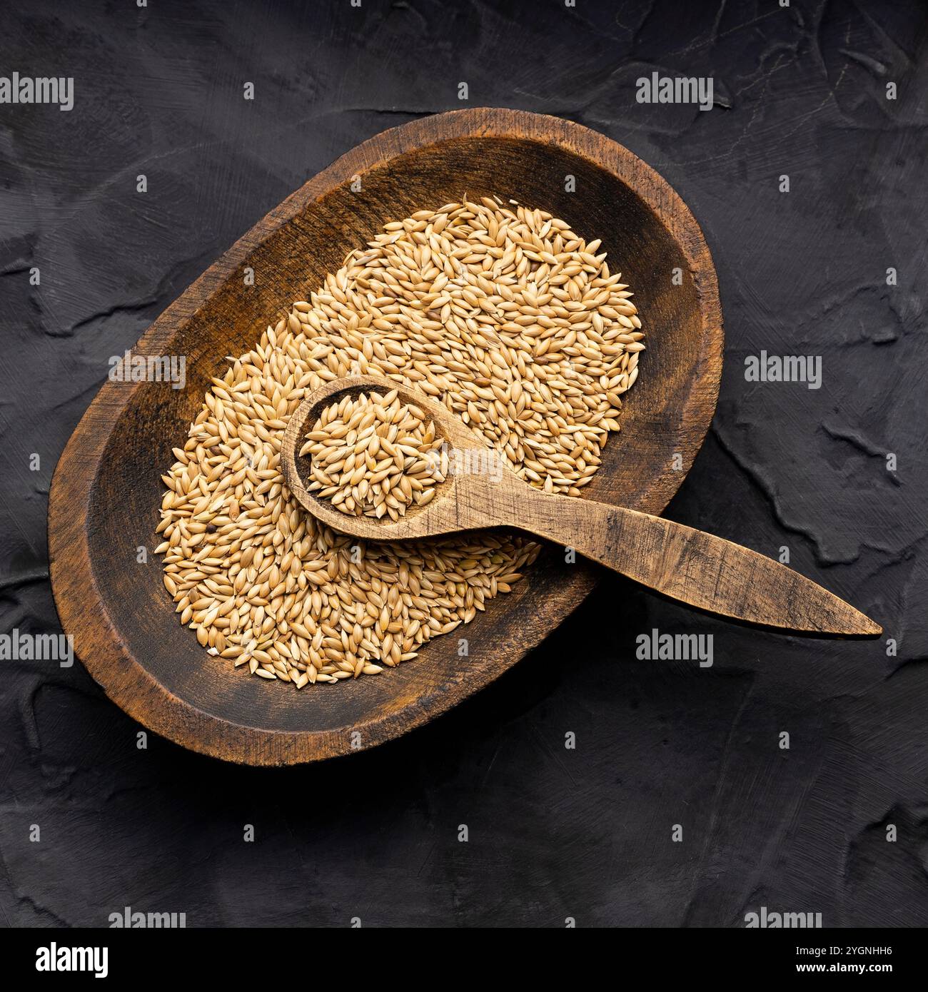 Phalaris canariensis - Canary seed in the spoon and bowl Stock Photo ...
