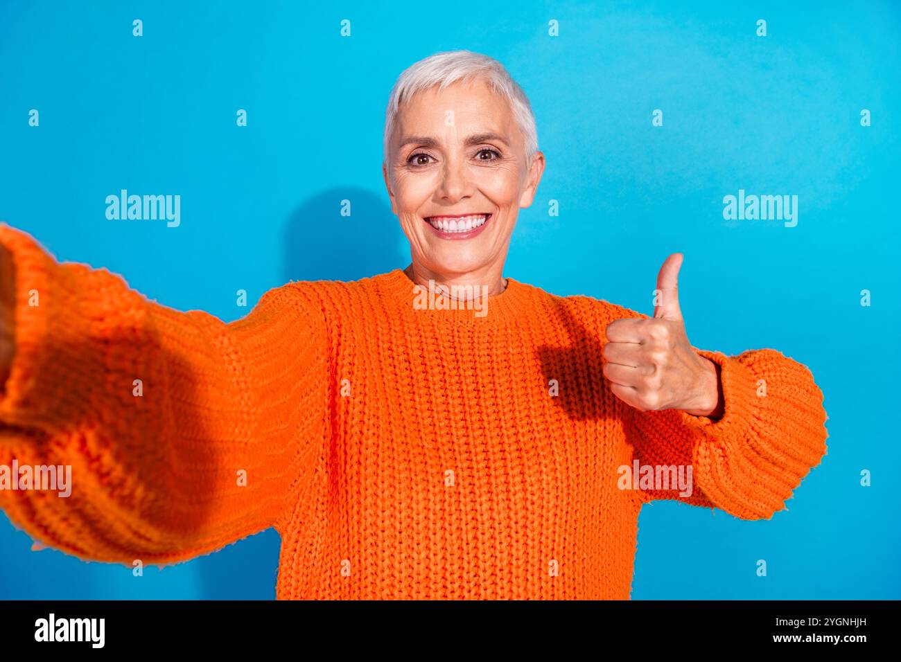 Photo of retired lady make selfie showing thumb up symbol fine ads wear ...