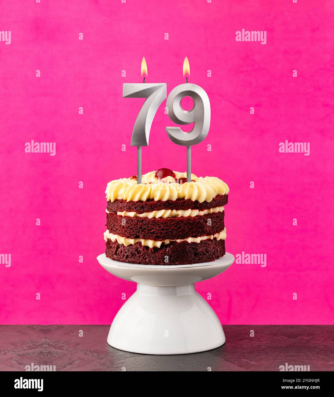 Birthday cake with number 79 candle - Red velvet on a fuchsia ...
