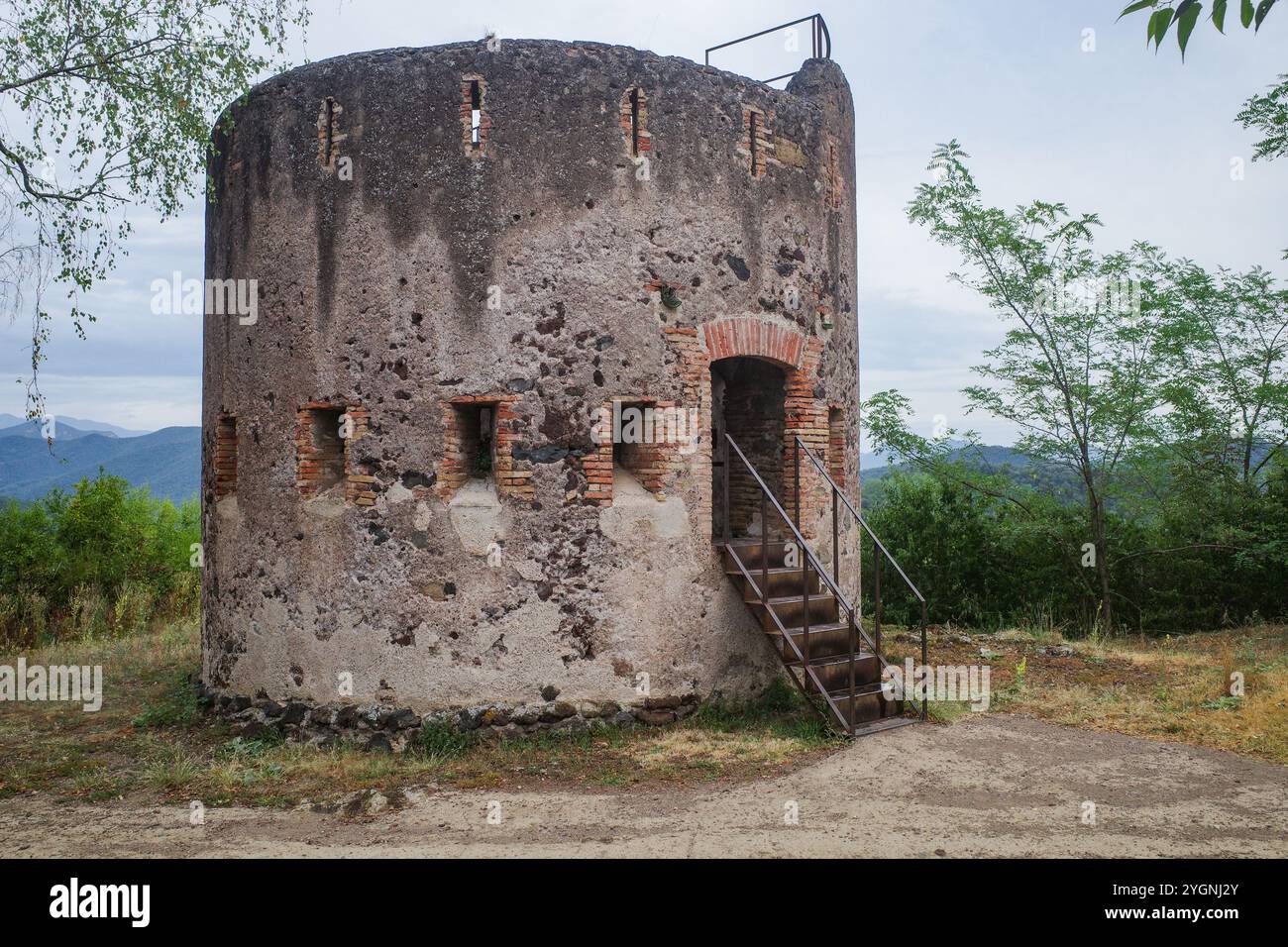 Olot, Spain - 7 Aug, 2024: Ruined lookout tower on edge of Crater del ...