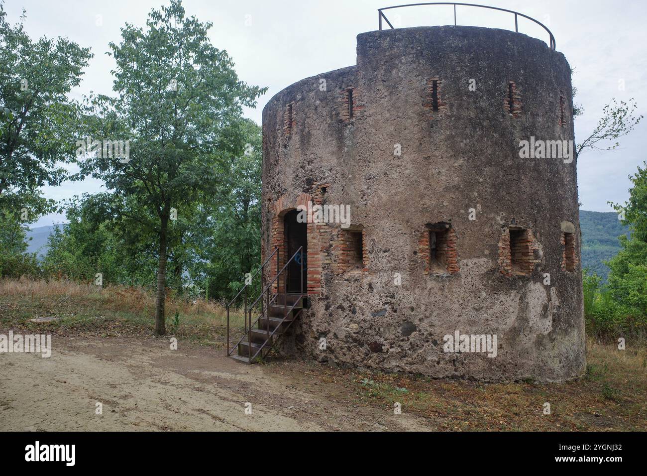 Olot, Spain - 7 Aug, 2024: Ruined lookout tower on edge of Crater del ...