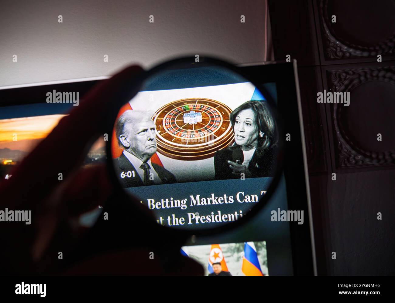 Paris, France - Nov 6, 2024: Magnifying glass held over TV screen ...