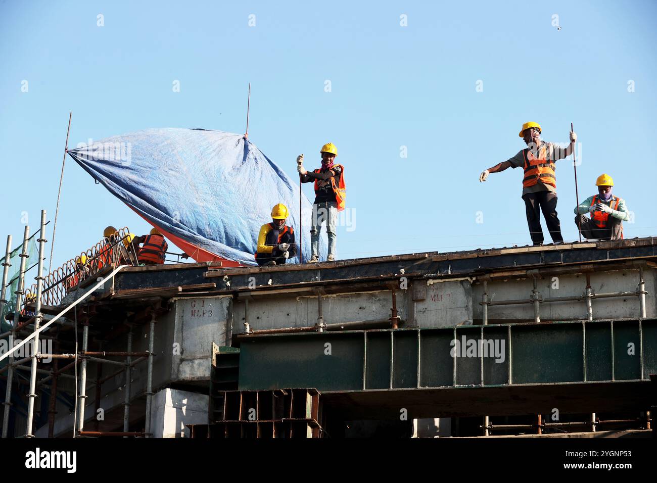 Dhaka, Bangladesh - November 08, 2024: Construction workers are working ...