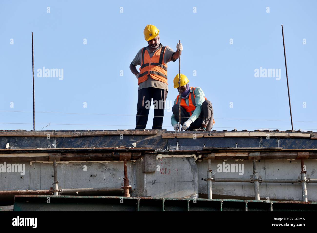 Dhaka, Bangladesh - November 08, 2024: Construction workers are working ...