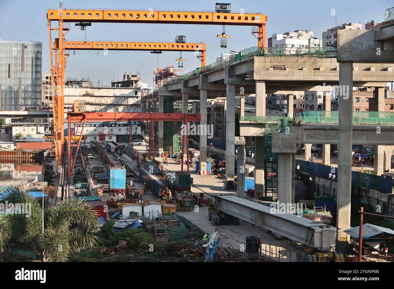 Dhaka, Bangladesh - November 08, 2024: Construction workers are working on the Moghbazar section ...