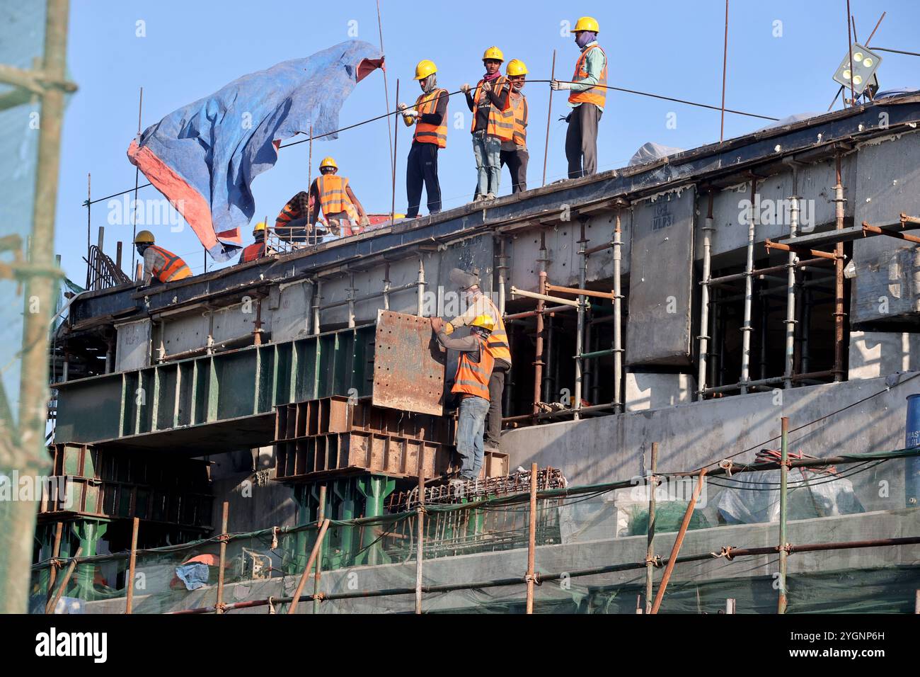 Dhaka, Bangladesh - November 08, 2024: Construction workers are working ...