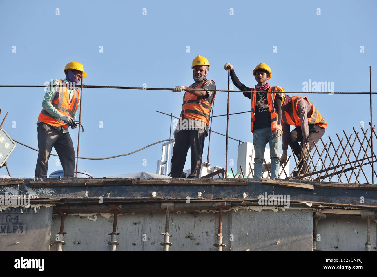 Dhaka, Bangladesh - November 08, 2024: Construction workers are working ...