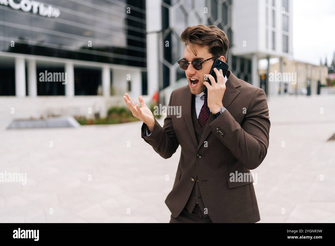 Young businessman talking angrily on hi-res stock photography and ...