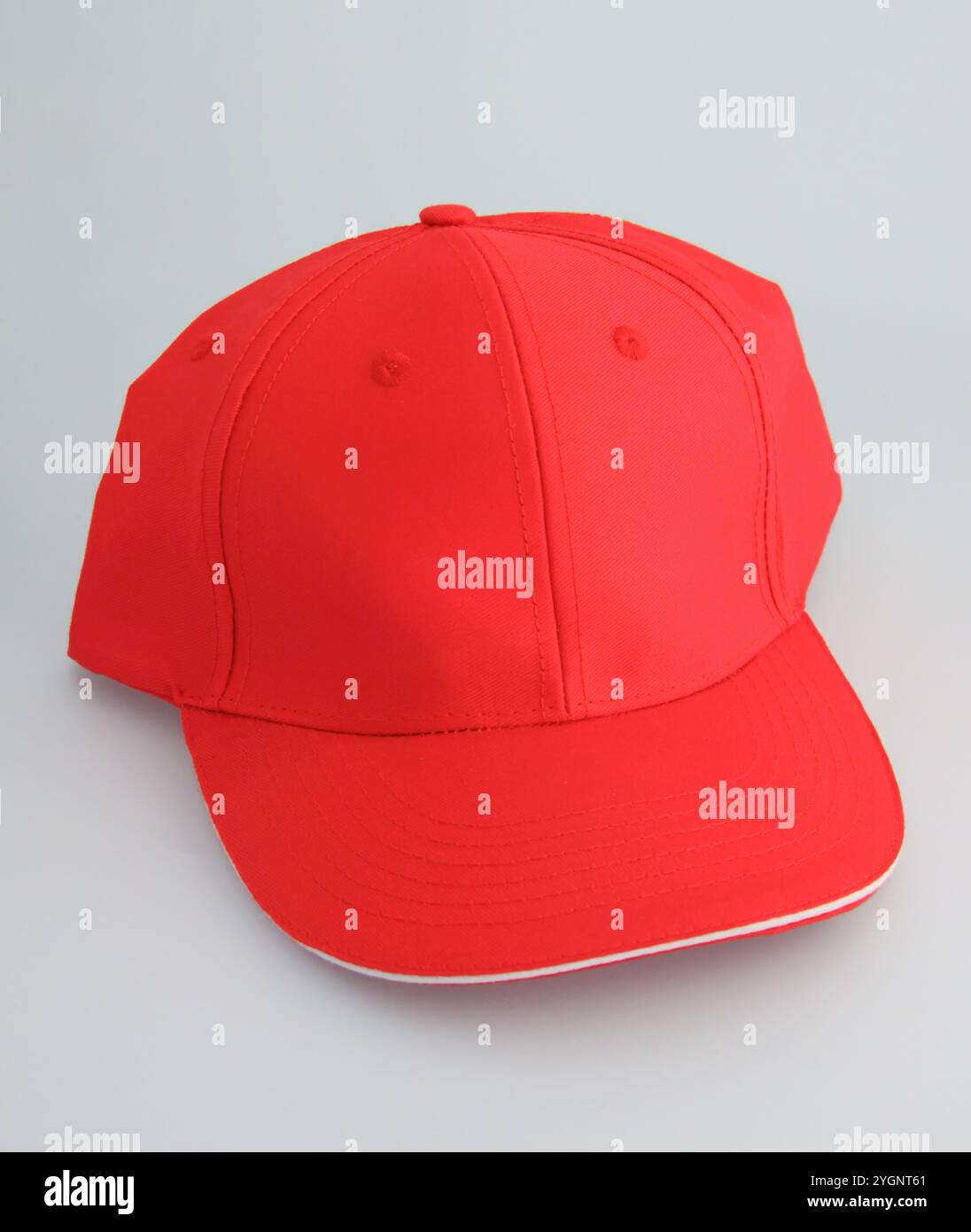Classic red baseball cap with a contrasting white brim, perfect for ...
