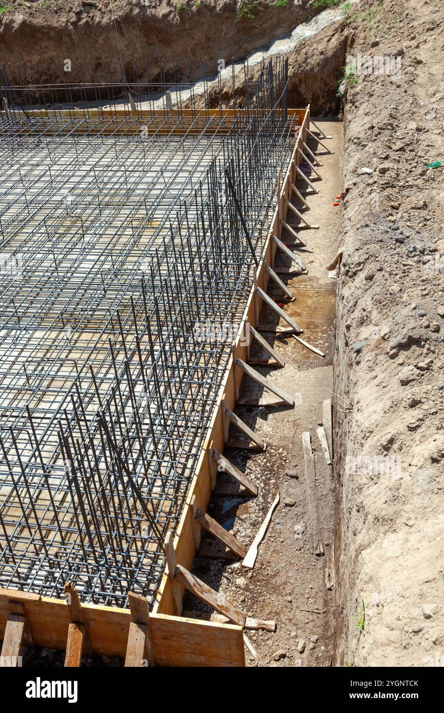 Steel reinforcement bars and wooden formwork create the structure for a ...