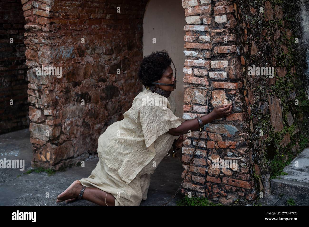 Black woman chained and with an iron mask on her mouth, representing ...