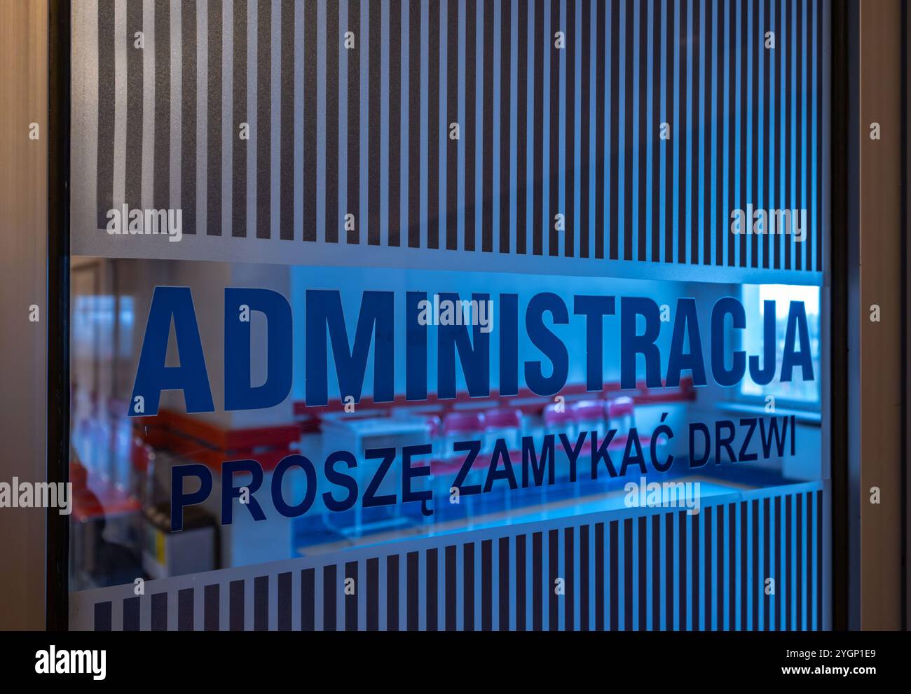 Transparent glass door, administration sign on the door, entrance to ...