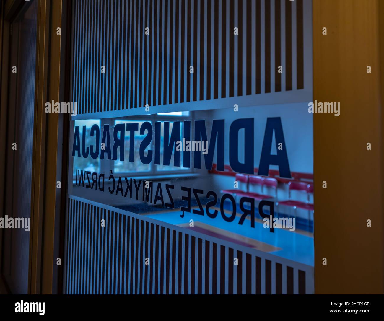 Transparent glass door, administration sign on the door, entrance to ...
