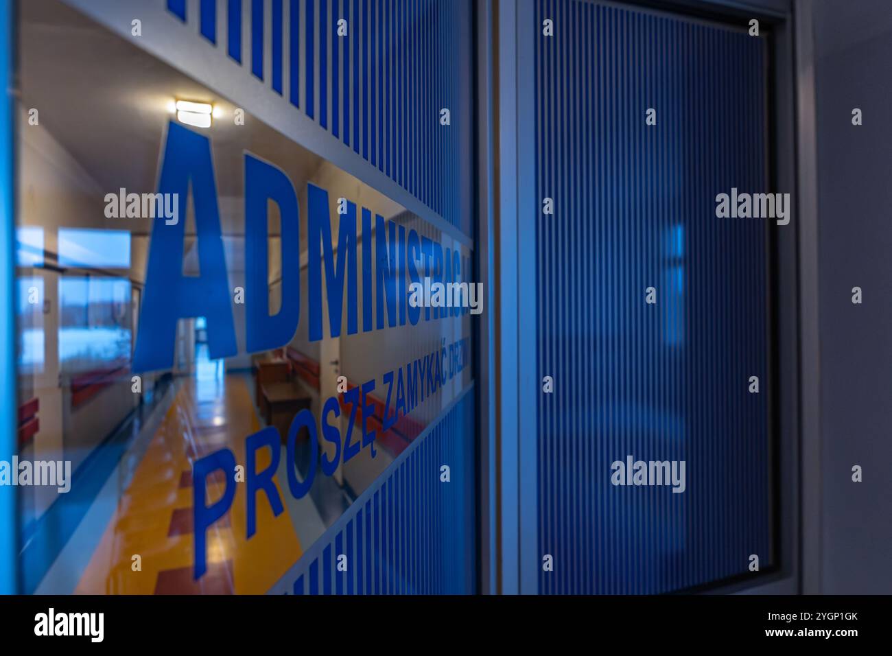 Transparent glass door, administration sign on the door, entrance to ...