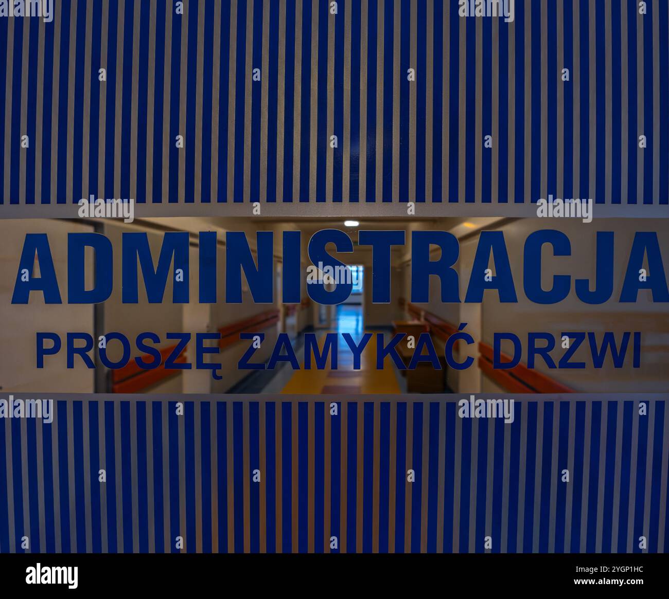 Transparent glass door, administration sign on the door, entrance to ...