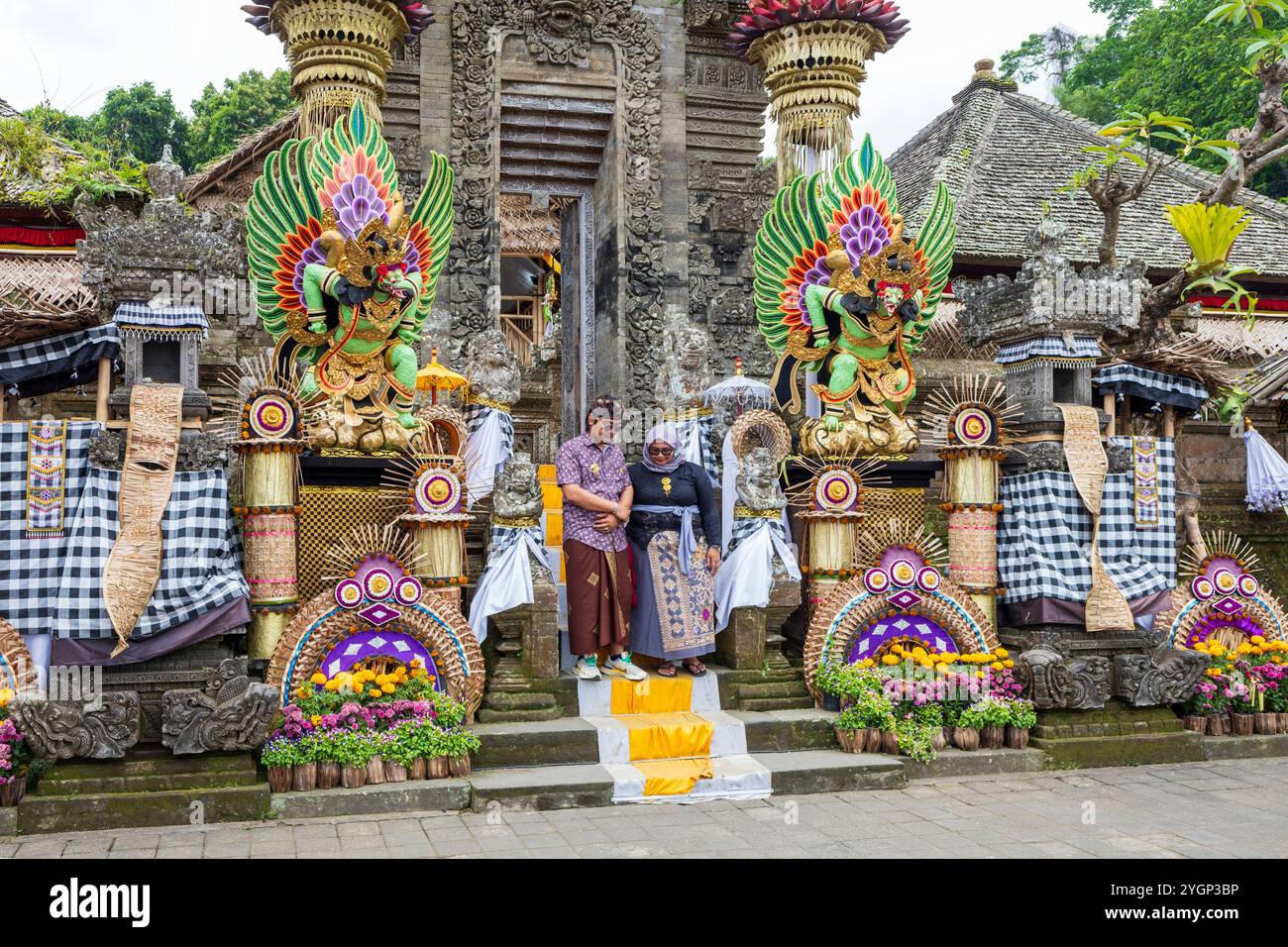 Colourfully decorated temple in the traditional Balinese village of ...