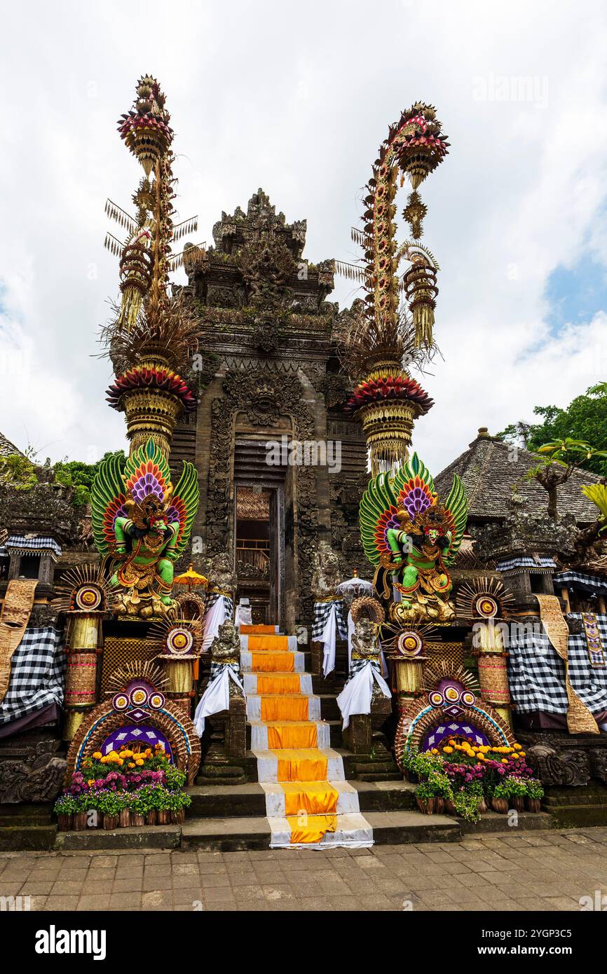 Colourfully decorated temple in the traditional Balinese village of ...