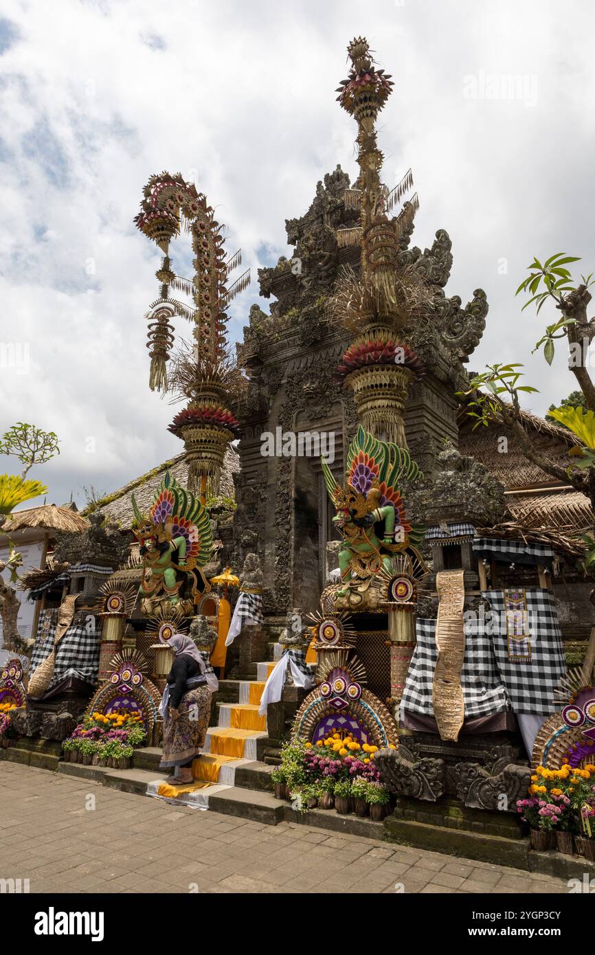 Colourfully decorated temple in the traditional Balinese village of ...