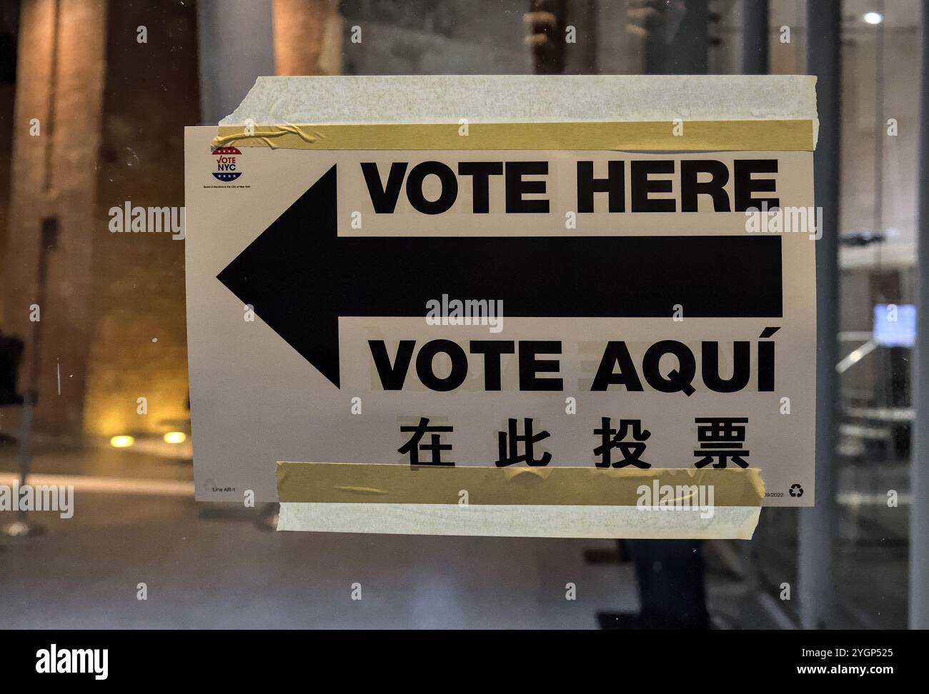 Vote Here sign with arrow on window of voting polling place, Brooklyn ...