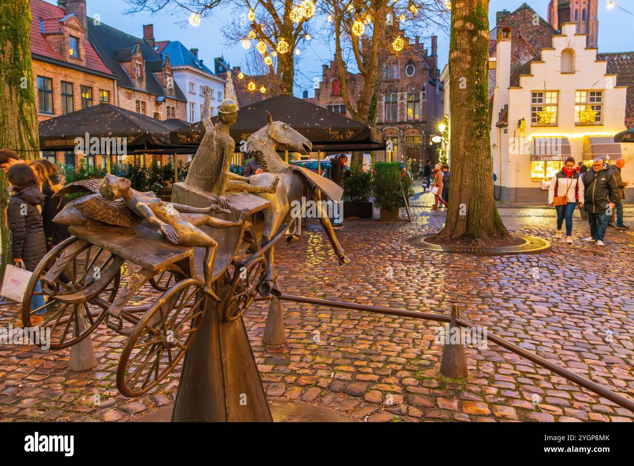 Belgium, Bruges,Walplein, small cobbled square and sculpture Zeus, Leda ...