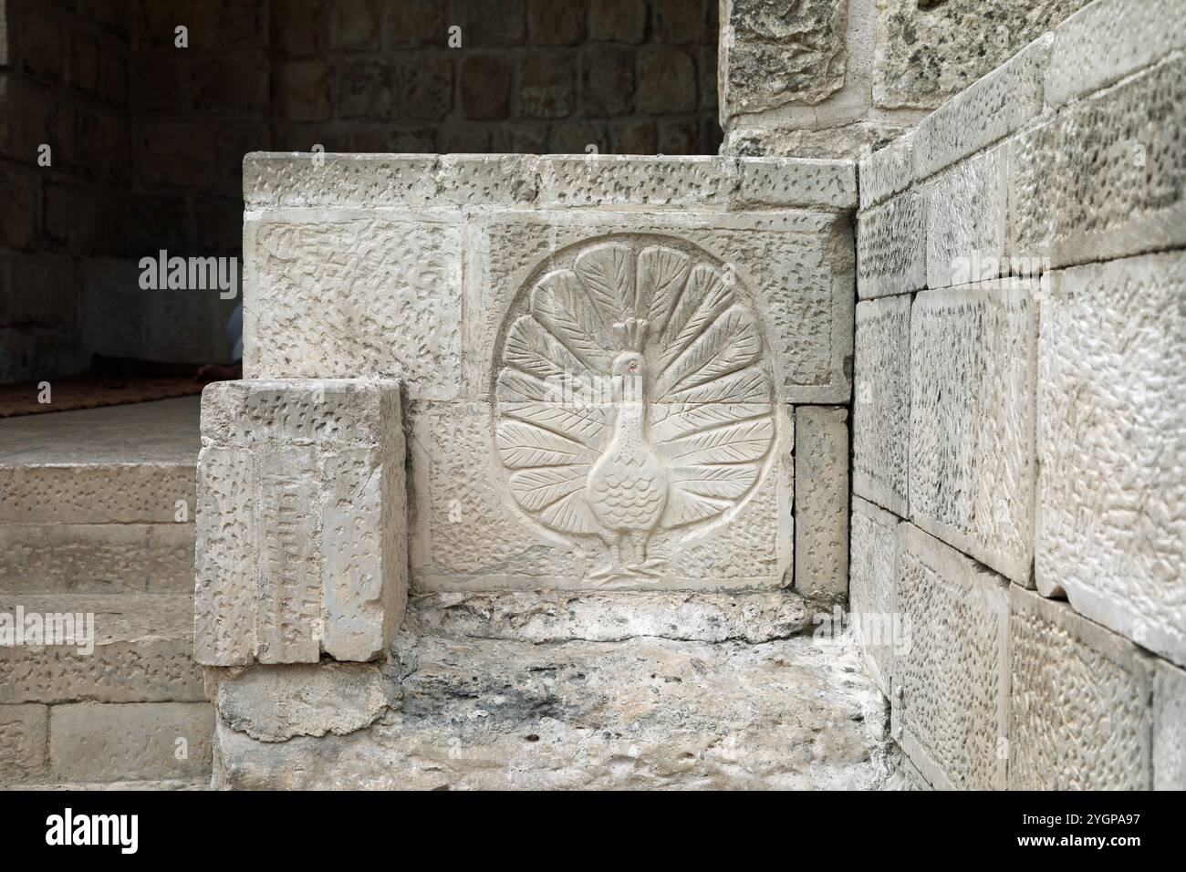 Symbolic Peacock Angel carving at the Yazidi mountain temple of Lalish ...