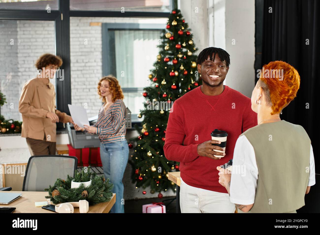 Festive colleagues enjoy the holiday spirit while sharing smiles and ...