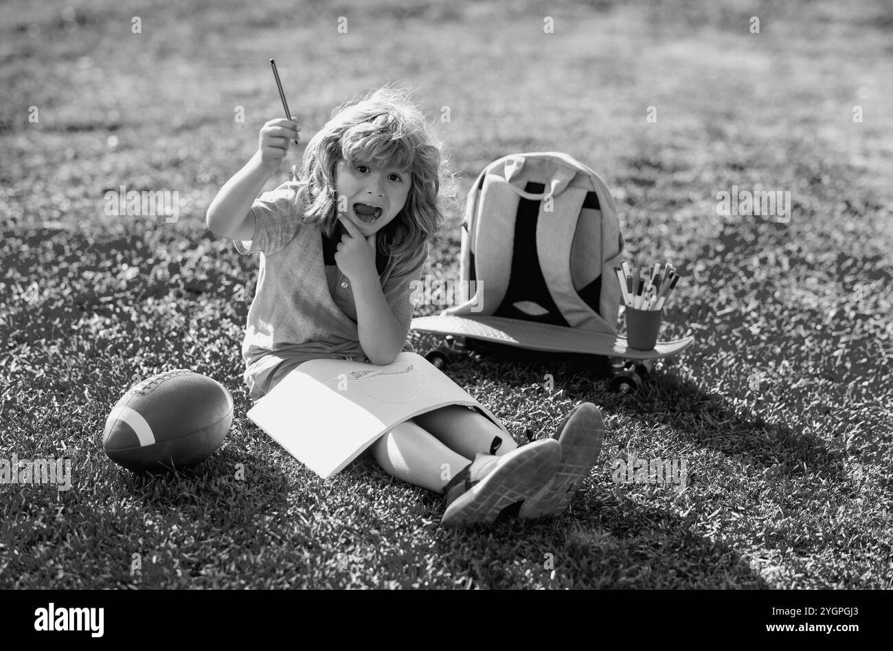 Child painter draw on playground. School kid drawing in summer park ...