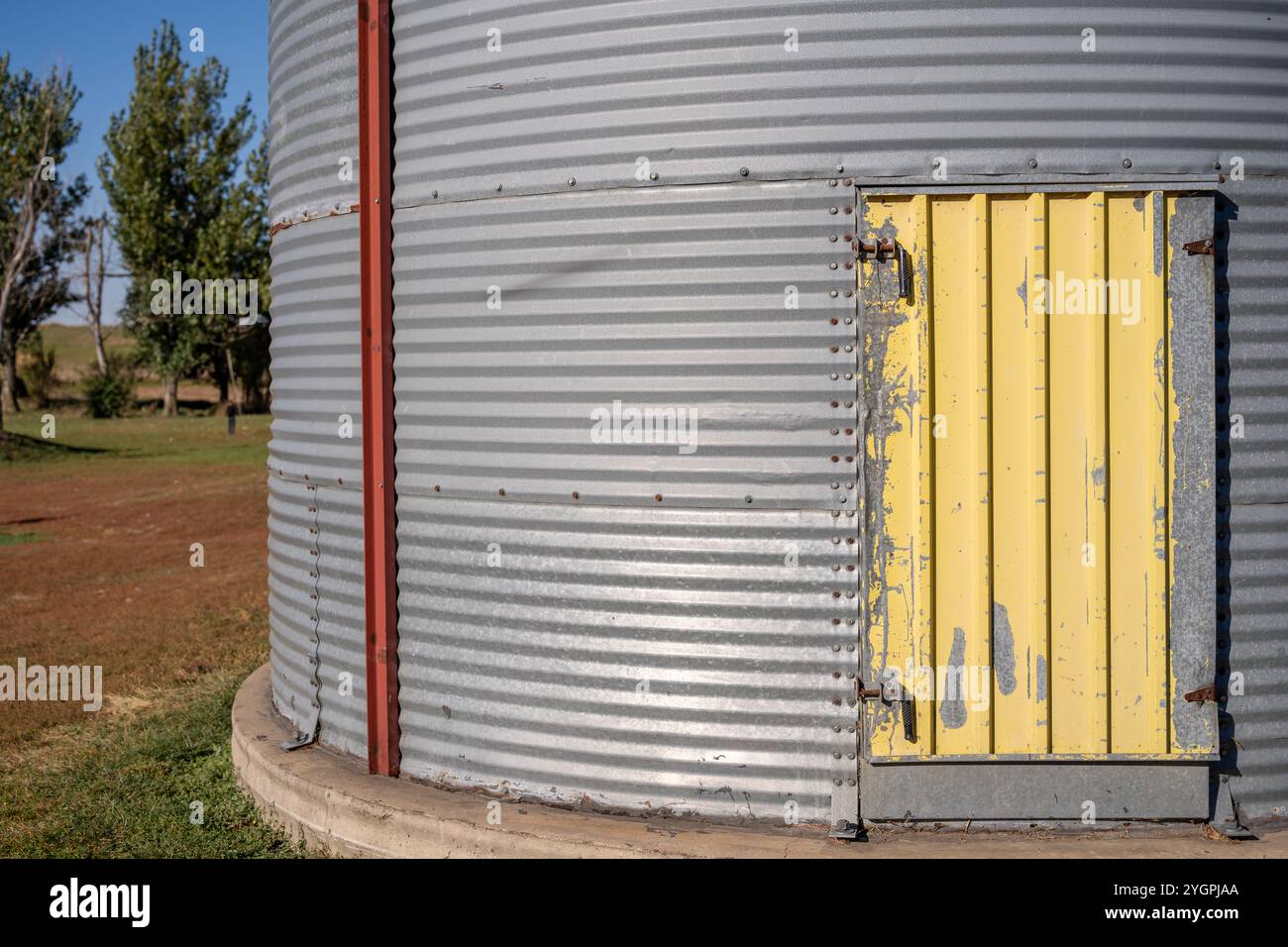 Side entry door hatch on a flat bottomed metal grain bin on a family ...