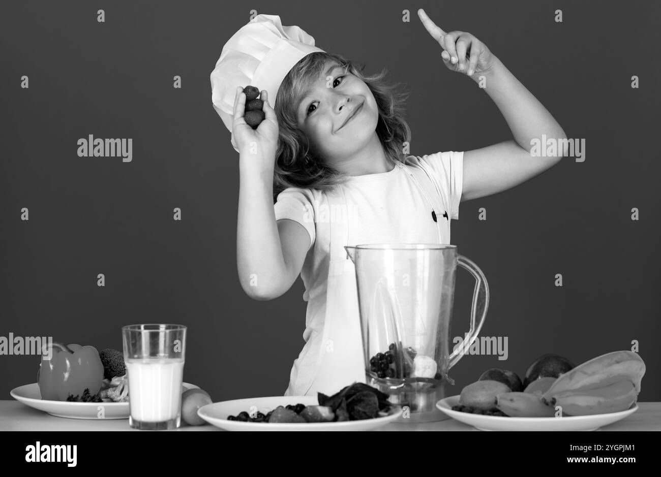 Portrait of chef child in cook hat. Cooking at home, kid boy preparing ...